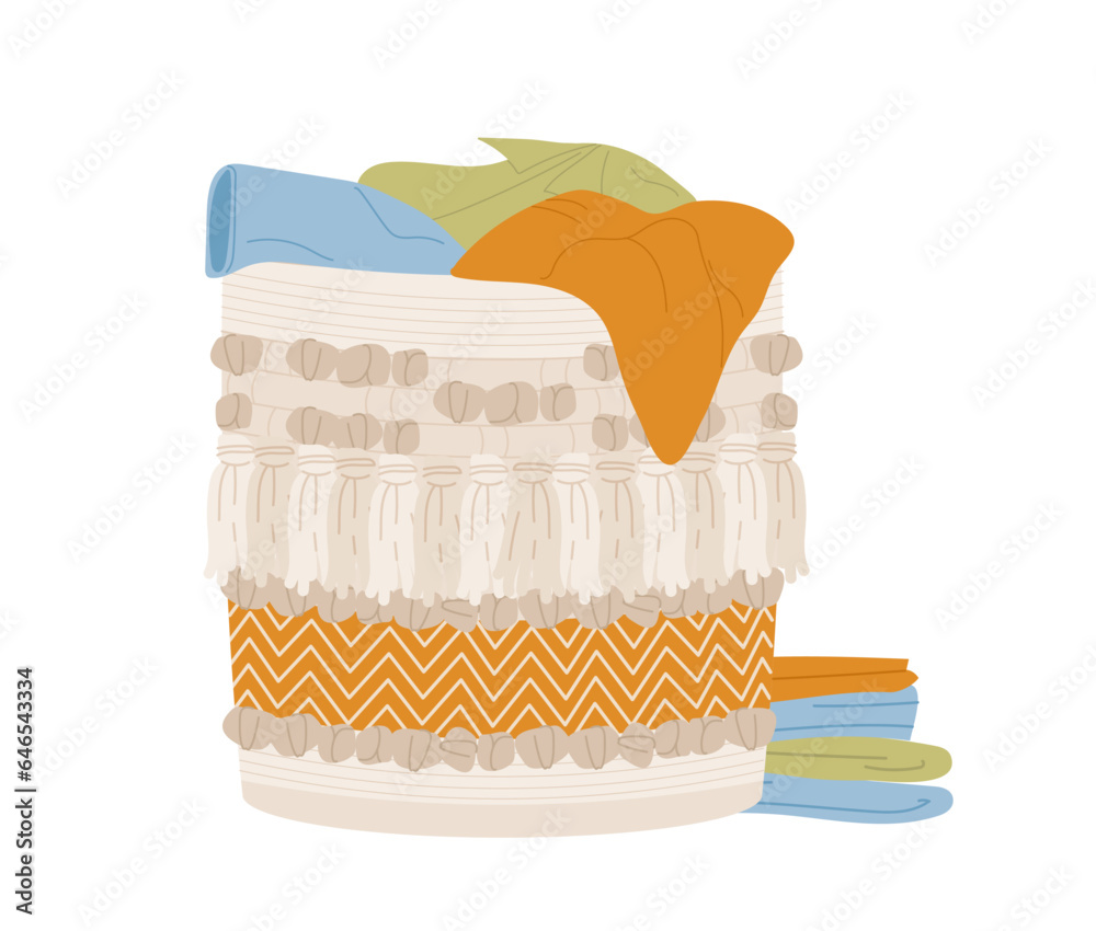 Basket with clean clothes concept. Stack of shirts and jeans ...