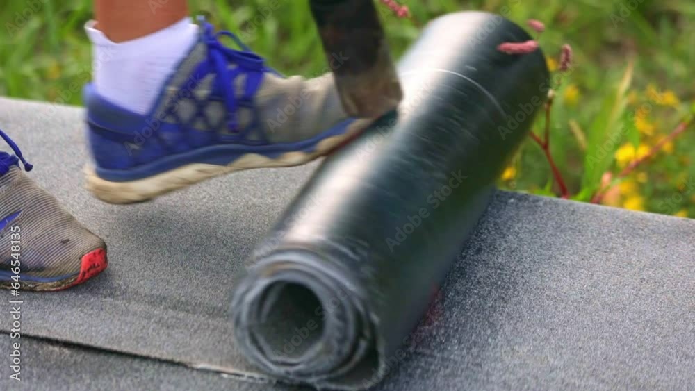 Process of melting roll of tar onto the foundation of a house under ...