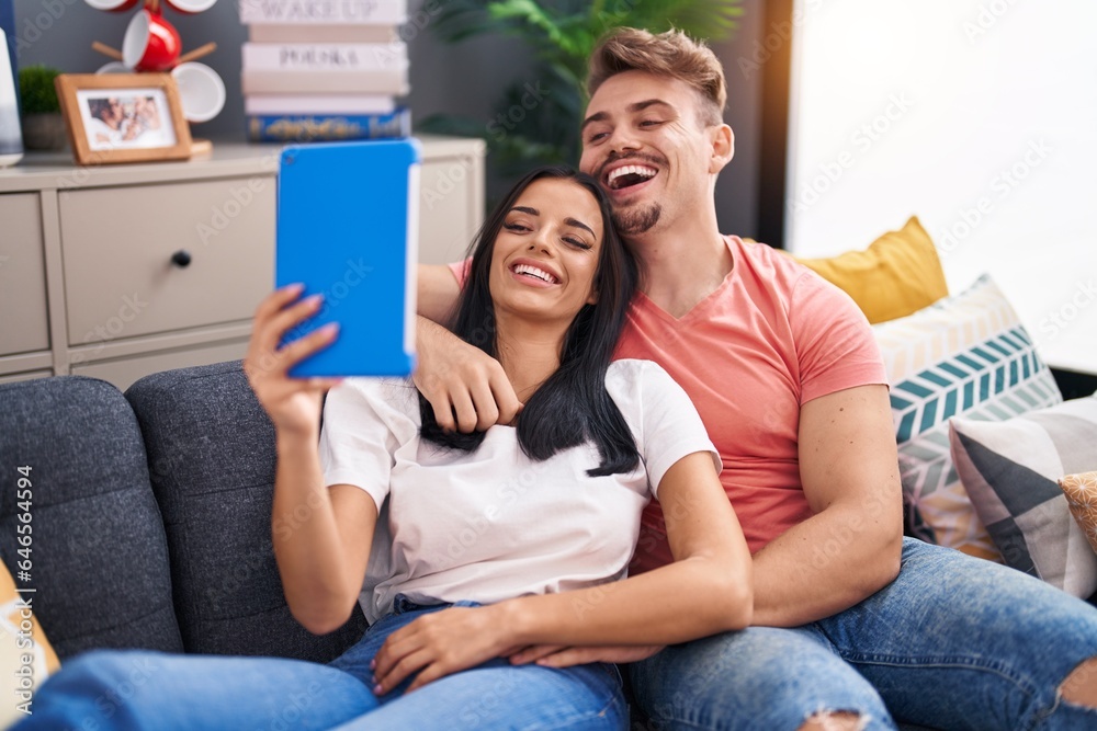 Man and woman couple using touchpad having video call at home Stock ...