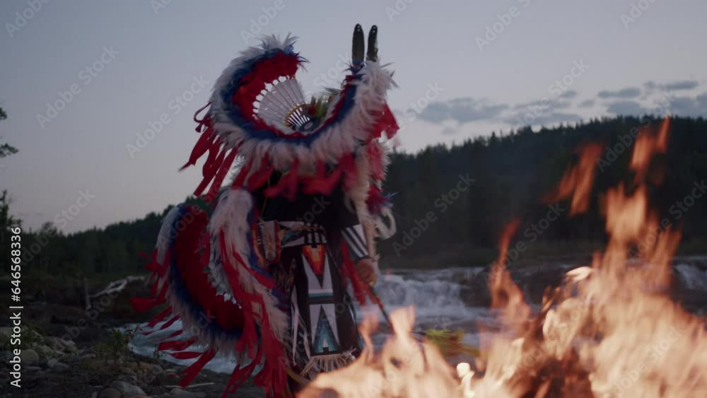 Native American Indigenous Dancing by the fireplace at sunset in ...