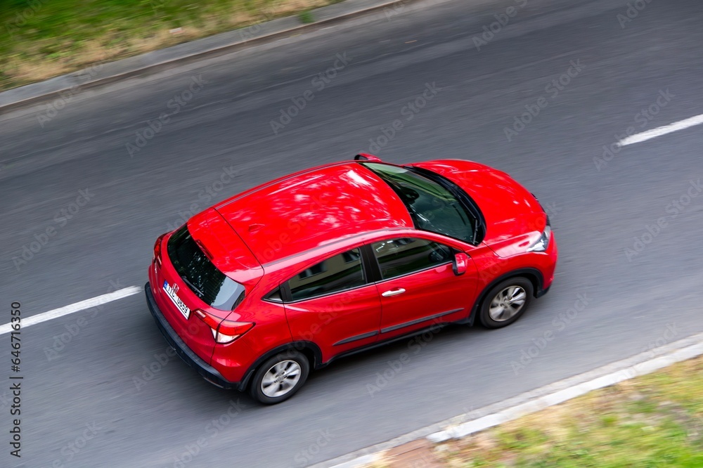 Red Honda HR-V (Vezel) crossover car from top view with motion blur ...