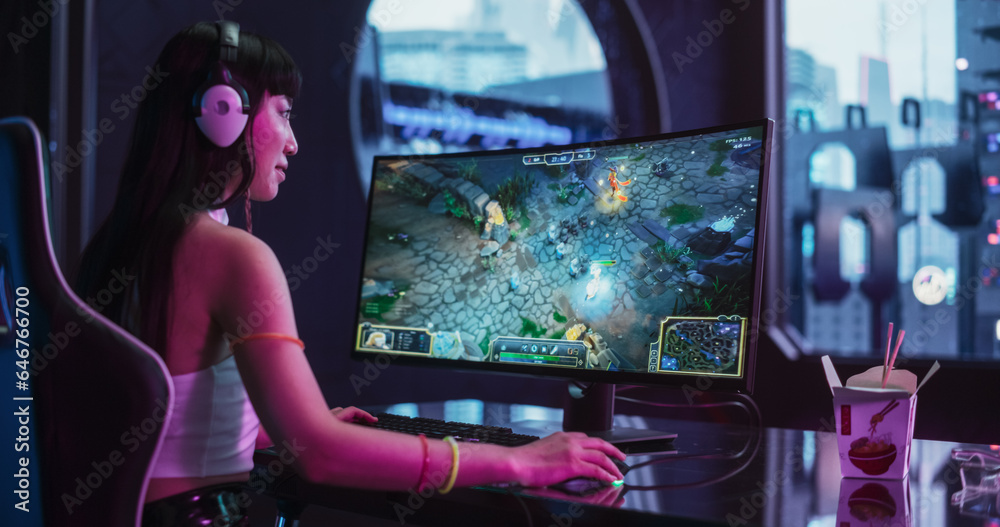 Focused Japanese Gamer Girl Playing Video Games on a Computer in a ...