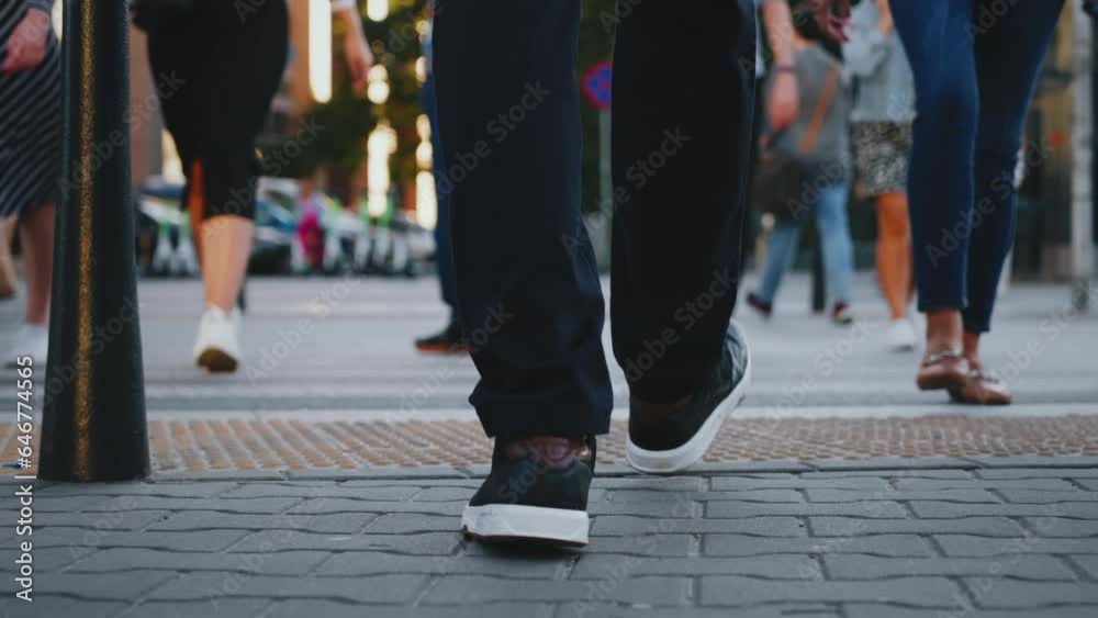 Rear back view following male feet steps crossing busy street. Man ...