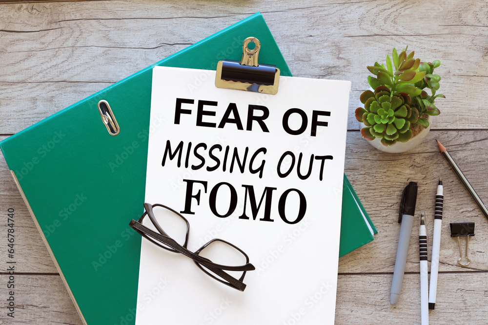 FOMO fear of missing out symbol. Copy space. text on white a4 paper ...