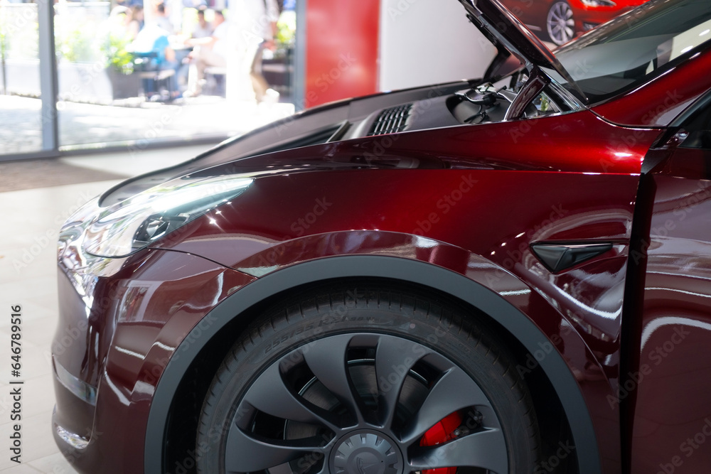 Tesla car model Y in cherry red color in Studio, electric vehicle in ...