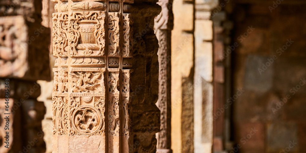 Stone columns with decorative bas relief of Qutb complex in South Delhi ...