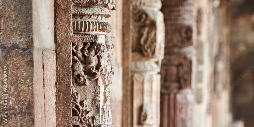 Stone columns with decorative bas relief of Qutb complex in South Delhi ...