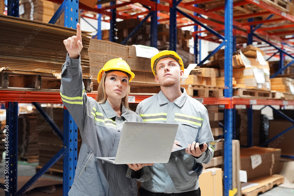Warehouse workers checking the inventory. Products on inventory shelves ...