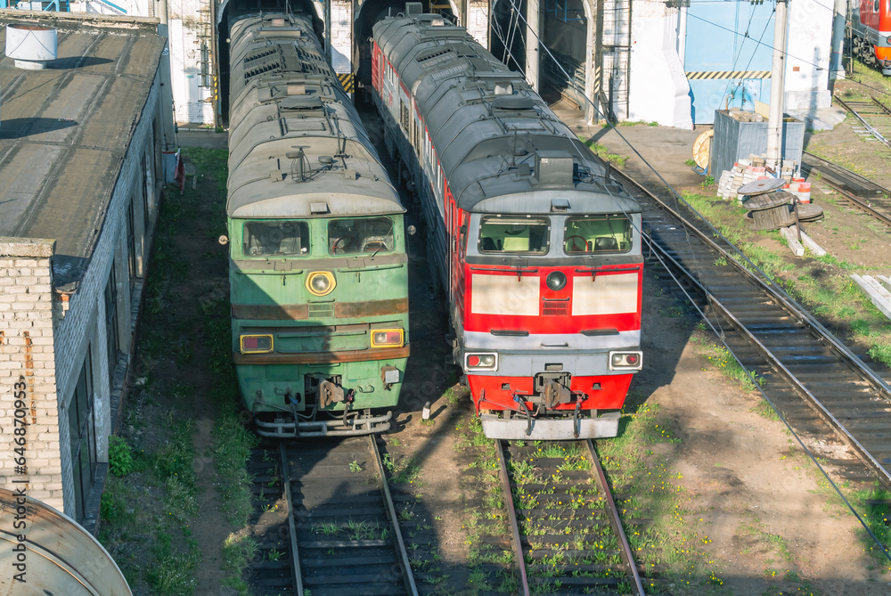 Old diesel locomotives near the railway depot. Railway transport ...