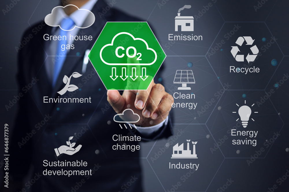 Businessmen pointing to zero carbon dioxide as a goal by 2050, as mean ...