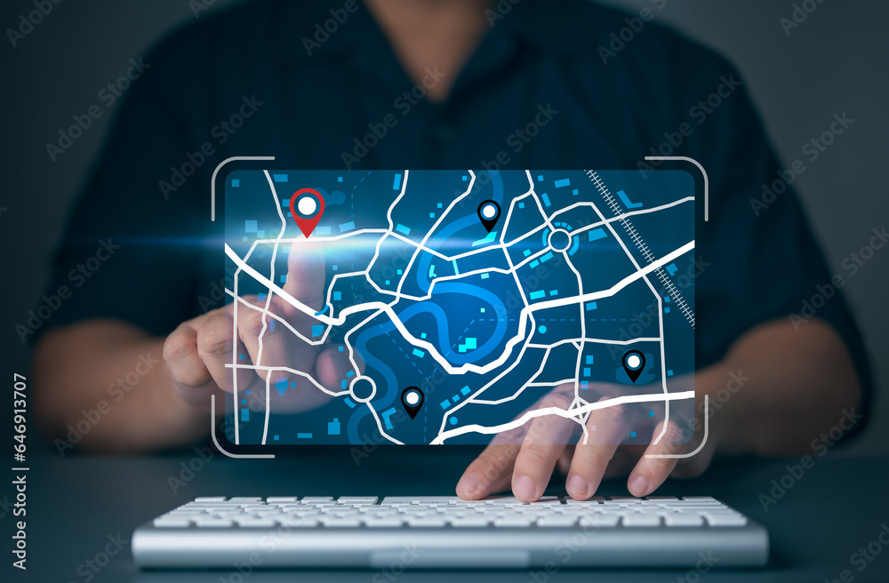 Businessman use computer keyboard to search for address on world map ...