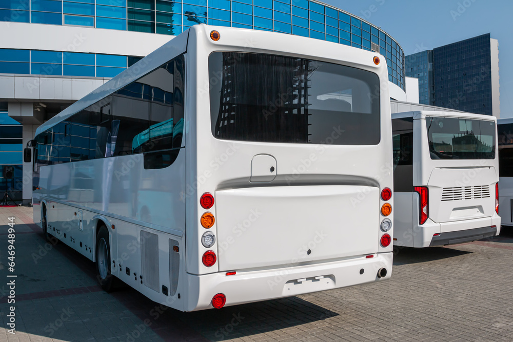 White intercity buses at the bus station on a clear day Stock Photo ...