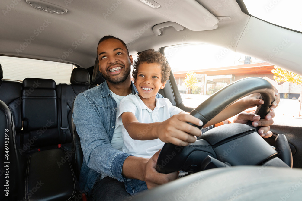 Photo & Art Print Happy african american father and son driving car ...