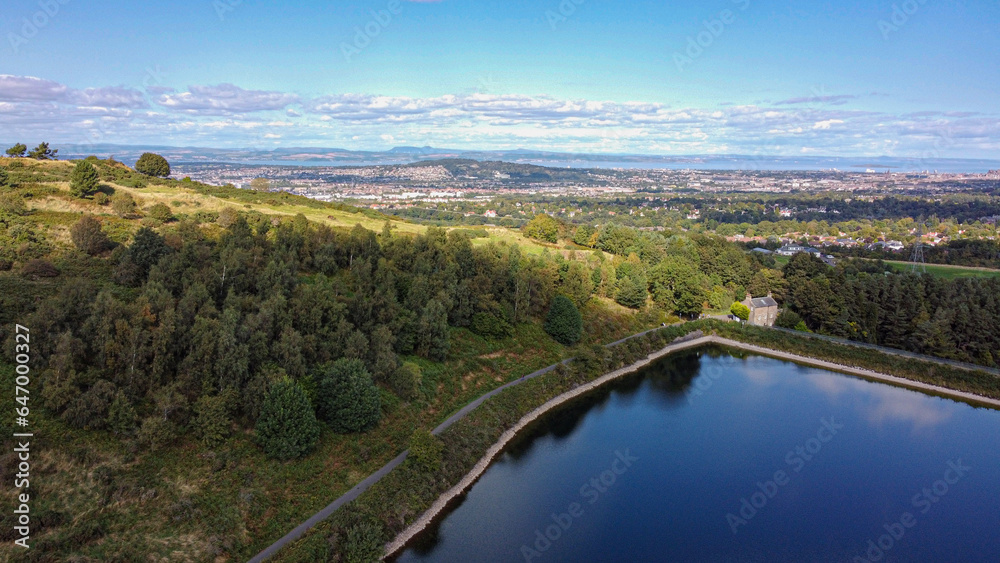 Edinburgh cityscape and Torduff Reservoir view. Torduff Reservoir and ...
