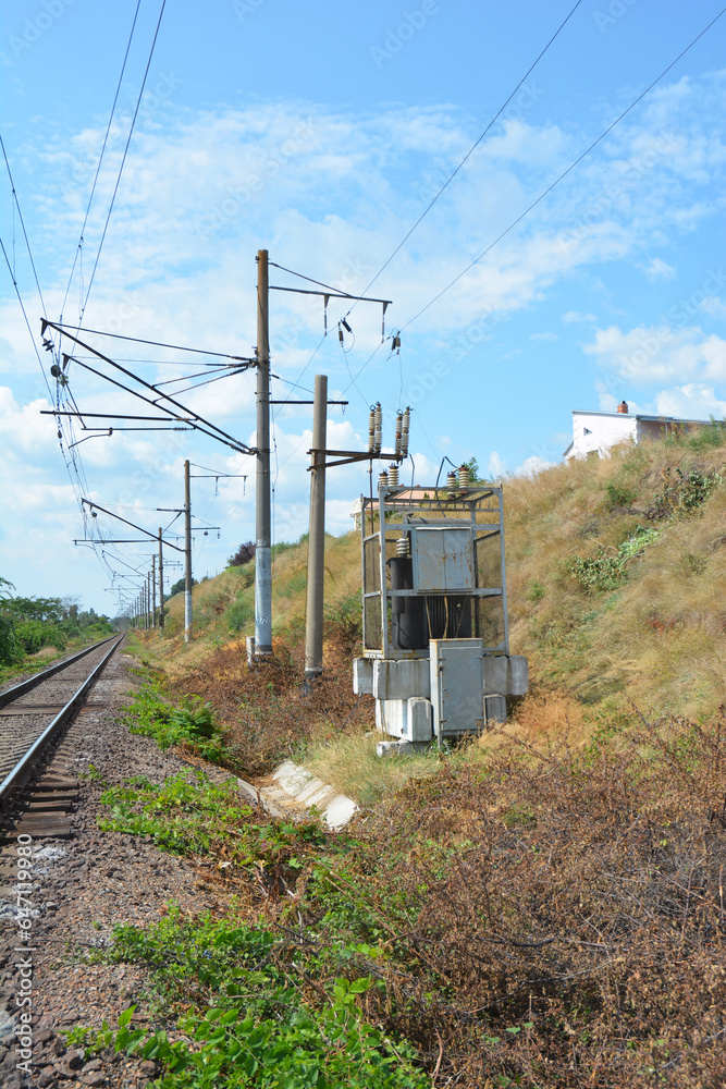 Railway booster transformer. High voltage transformer substation near ...
