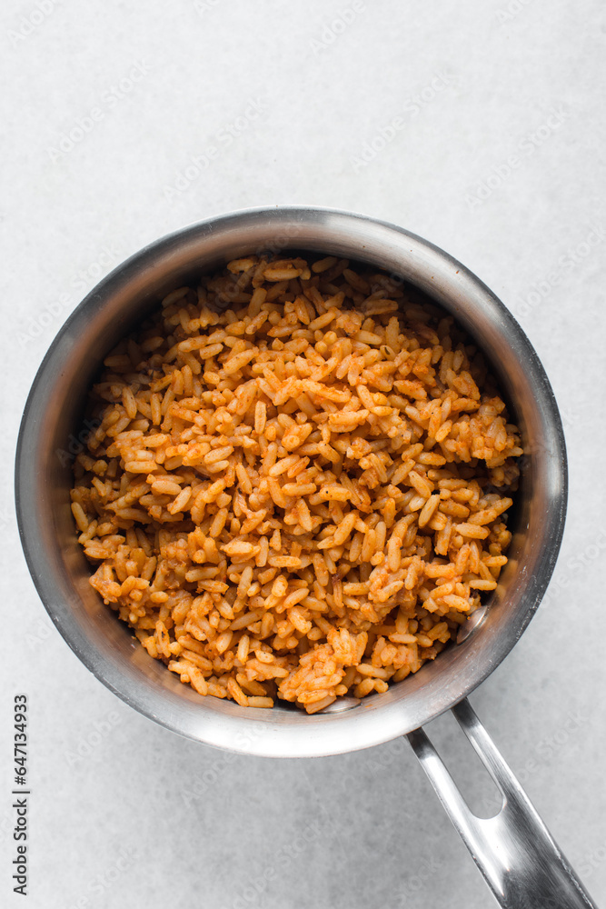 Jollof rice in a silver saucepan, homemade nigerian jollof rice in a ...