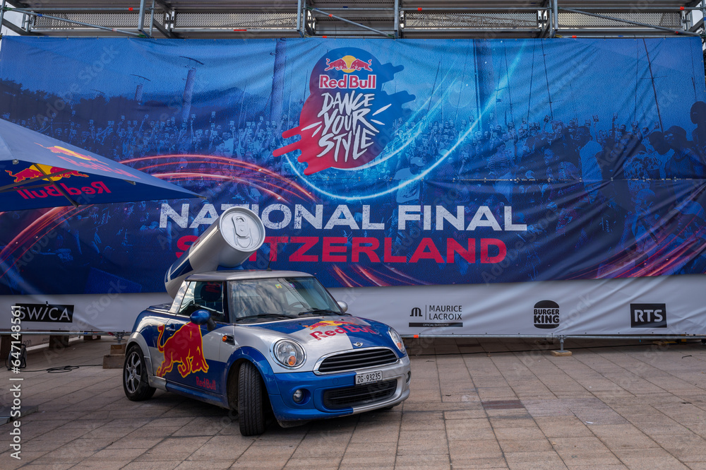Red Bull advertising Mini Cooper car with logo. Giant Red Bull energy ...