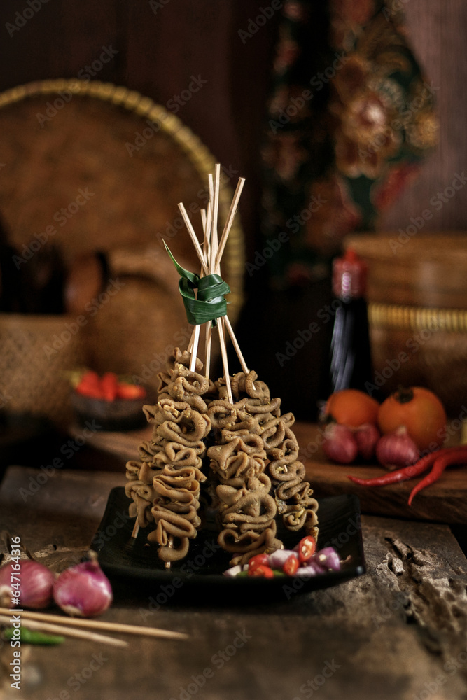 Traditional food from Indonesia called Satay Usus. Photos | Adobe Stock