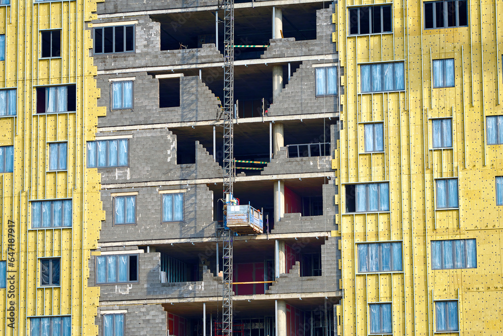 Insulation facade wall with mineral wool, installing new glass windows ...