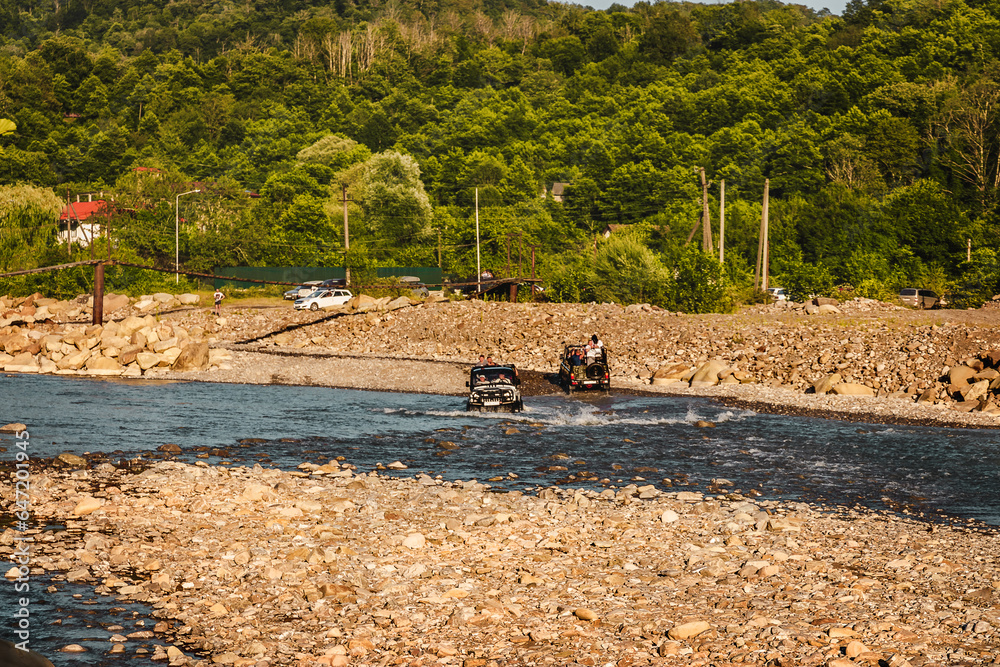 Off-road walking. An off-road trip along the bed of a mountain river ...