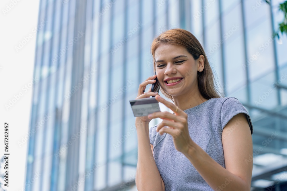 Young businesswoman doing digital banking transaction and making travel ...