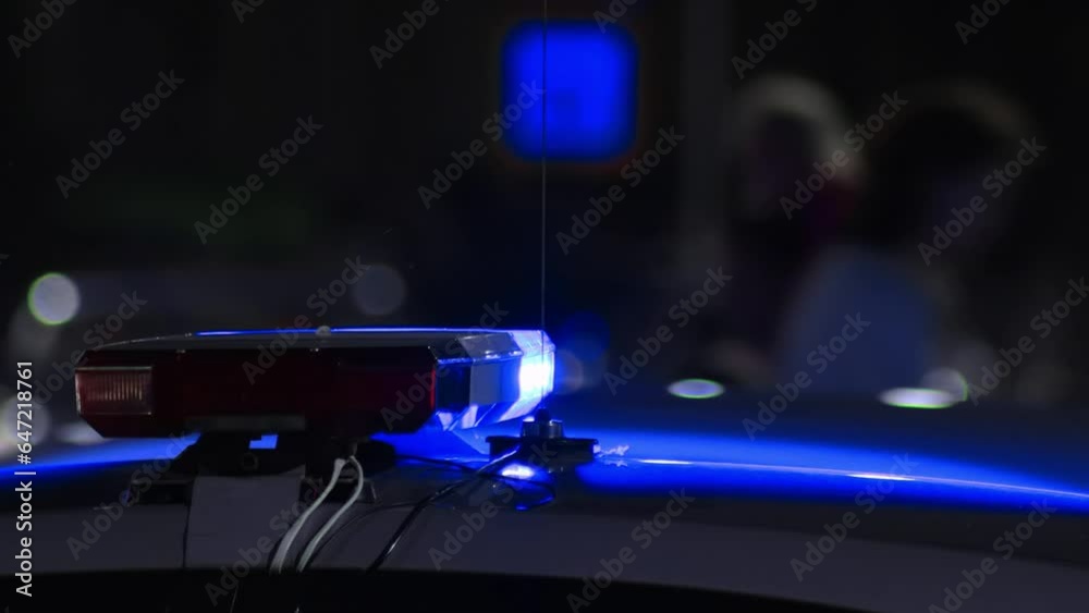 Working blue light flasher lightbar on police car at night, siren ...