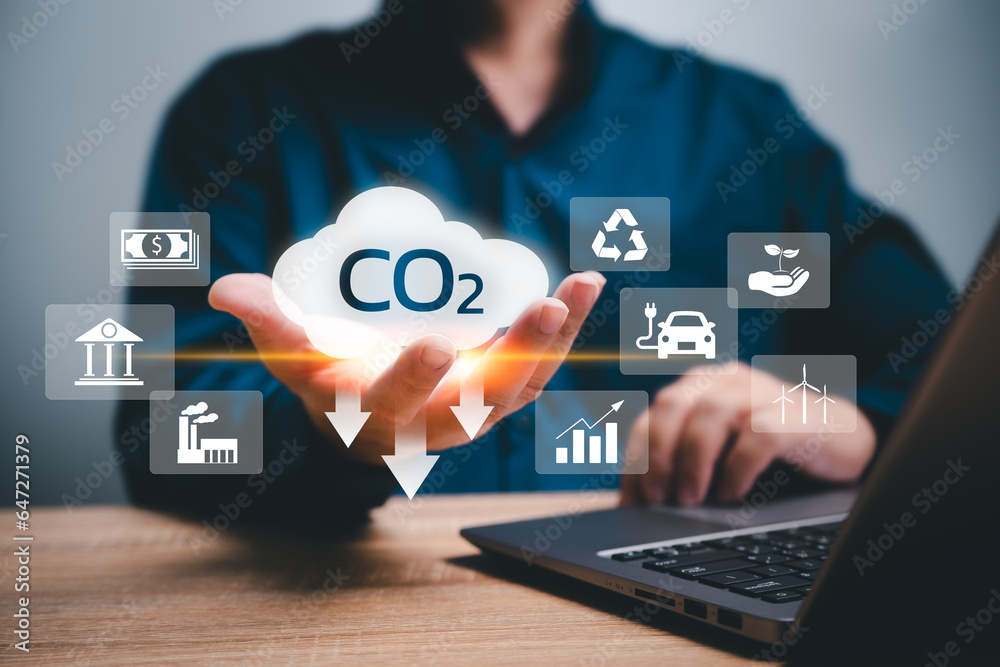 Reduce CO2 emission and green business concept, Businessman shows CO2 ...