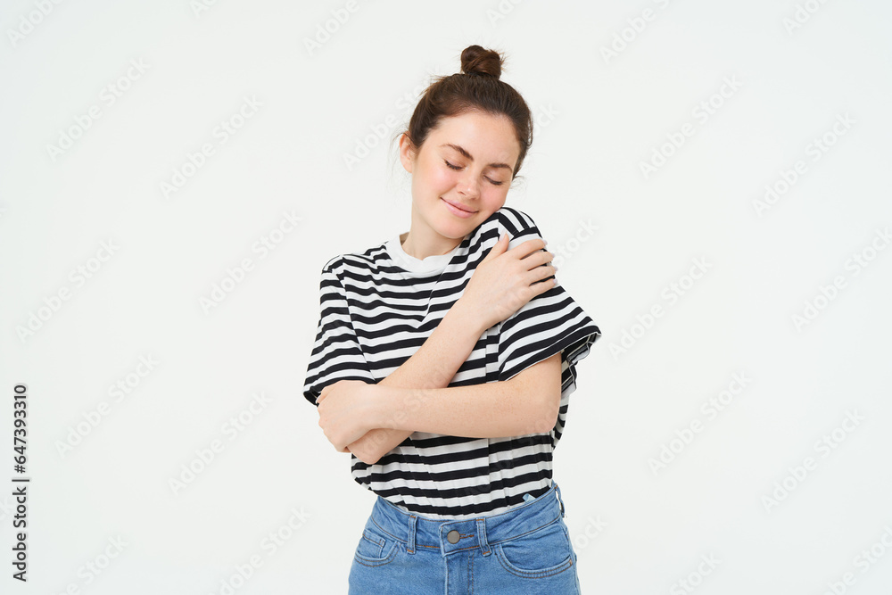 self-care and love. Young beautiful woman hugs herself, embraces own ...