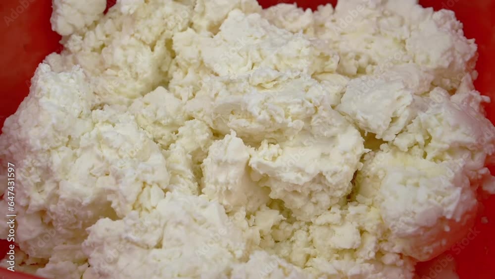 Texture of White Cottage Cheese in a Red Plastic Bowl on a Rotating ...