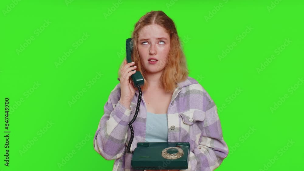 Tired bored woman talking on wired vintage telephone of 80s, fooling ...