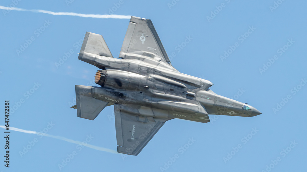 F-35 fighter makes a high speed afterburner pass with belly showing and ...