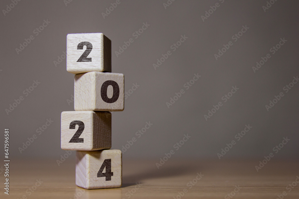 The numbers 2024 on vertically stacked wooden blocks. Business ideas ...