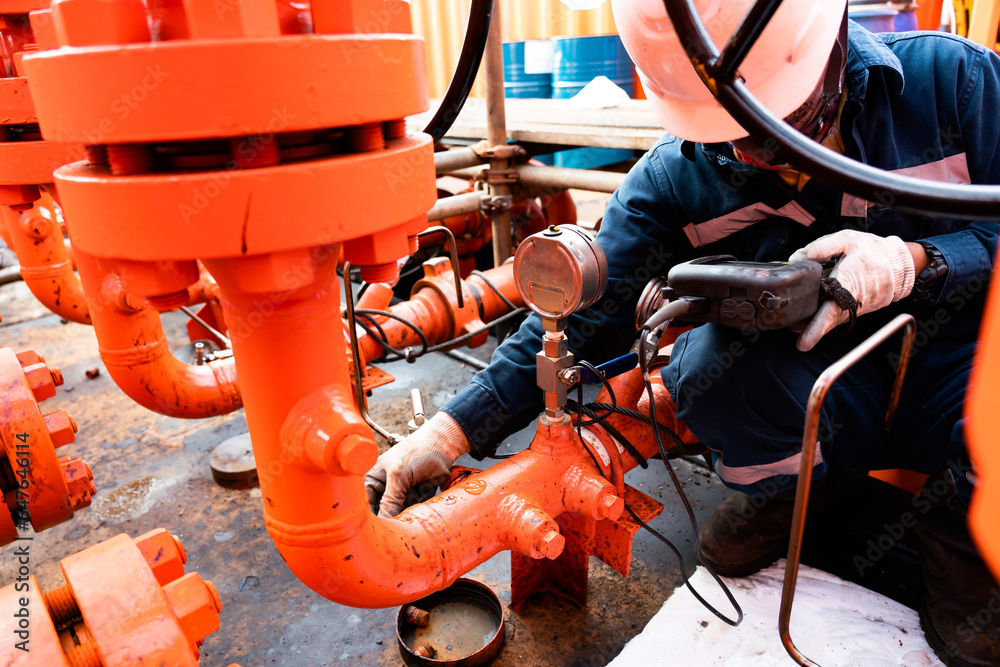 Non-destructive testing technicians are checking the thickness of elbow ...