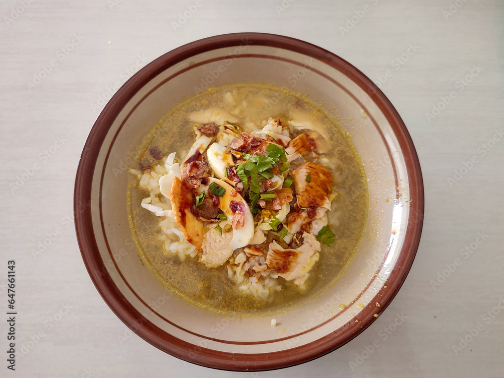 Simple soto ayam in a bowl with cream background. Soto ayam is a ...