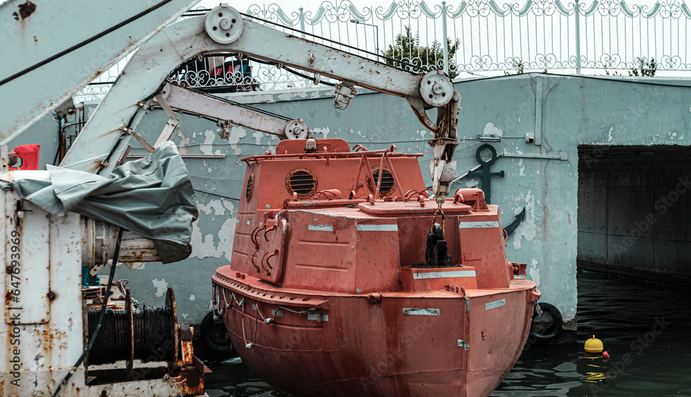 davit launched liferaft onshore, old rusty ship lifeboat, resque ...
