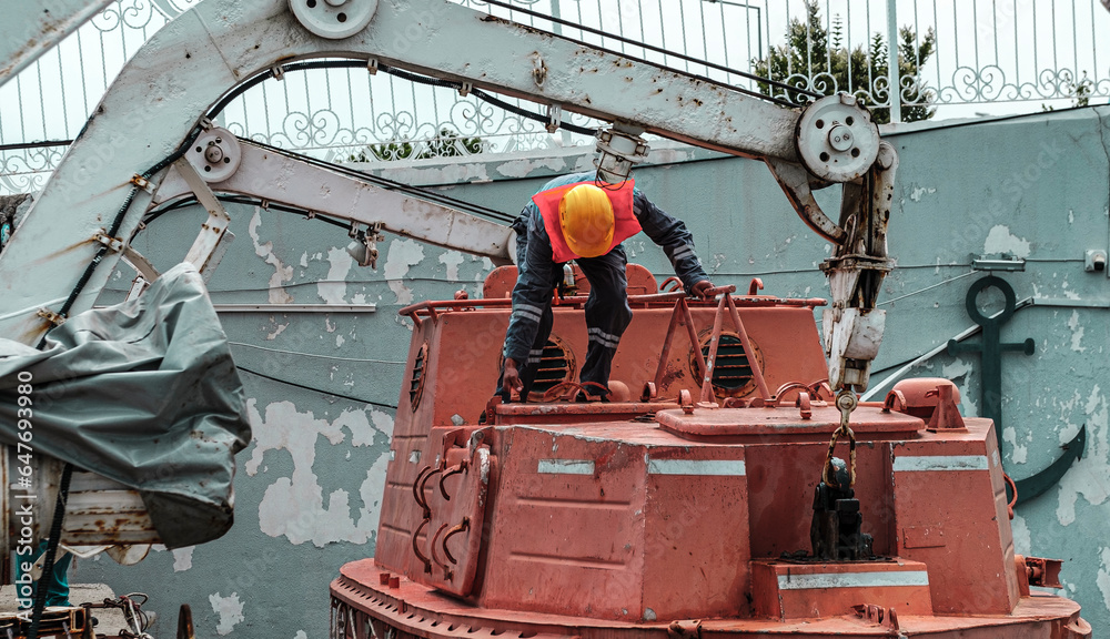 davit launched liferaft onshore, old rusty ship lifeboat, resque ...