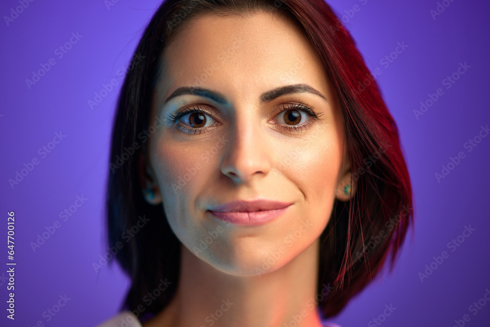 Portrait of beautiful woman in her 30s with short hair, looking at ...