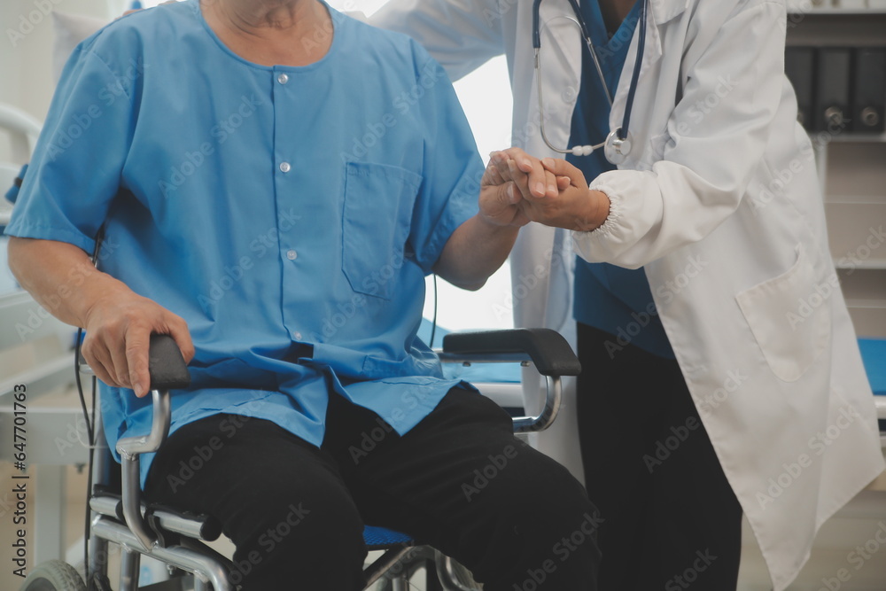 Asian older aged man doing physiotherapist with support from nurse ...