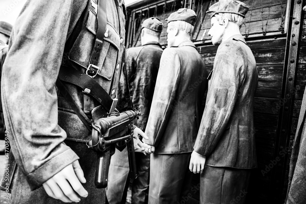 Close-up of german soldier with rifle in hand during deportation of ...