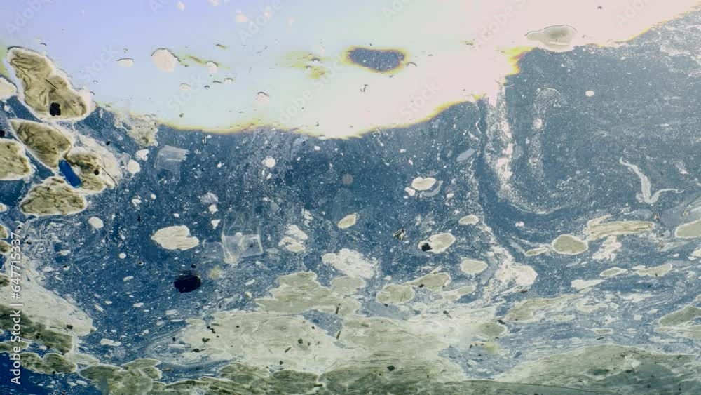 Thick oily layer mixed with plastic debris floating on surface of Ocean ...