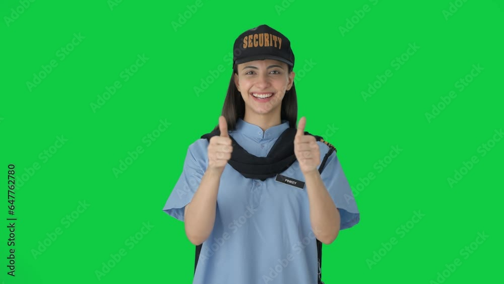 Happy Indian female security guard showing thumbs up Green screen Stock ...