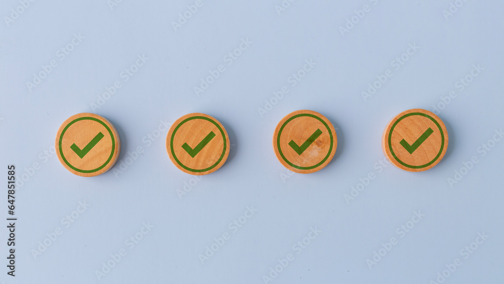 Check mark guarantee correct icons on wooden cubes on background ...