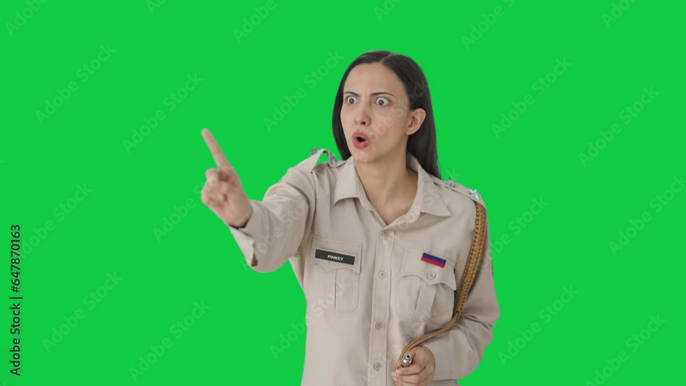 Angry Indian female police officer stopping someone using whistle Green ...