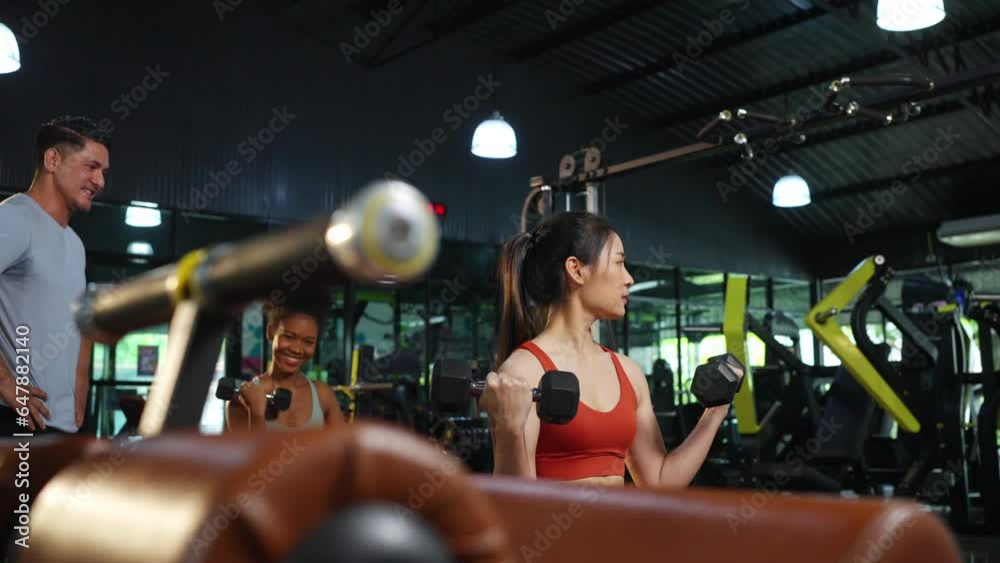 4K Group of People in sportswear do weight training workout exercise ...