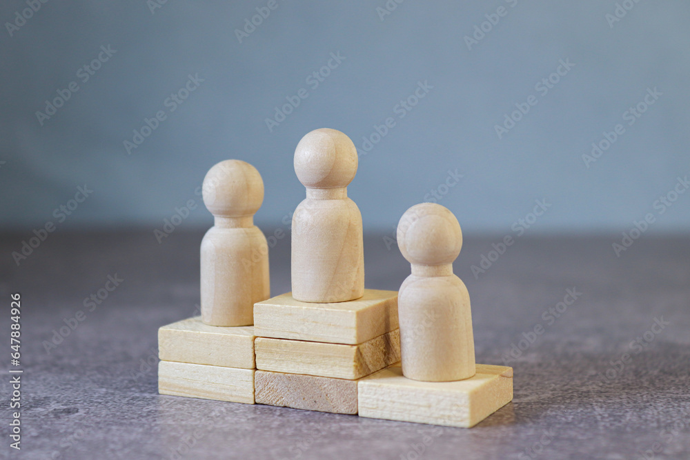 Winners podium from wooden blocks with knobbed cylinders and numbers 1 ...