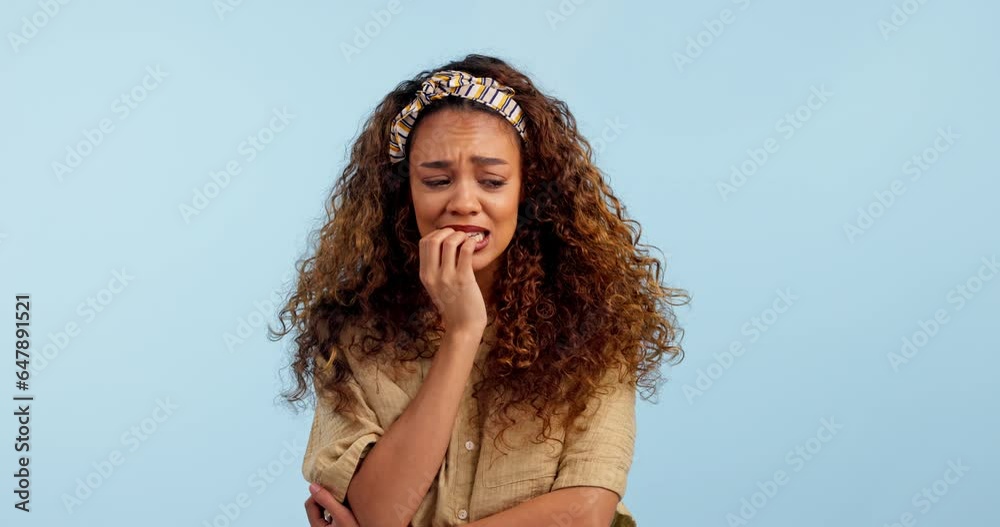 Stress, anxiety and young woman in studio biting her nails for crisis ...