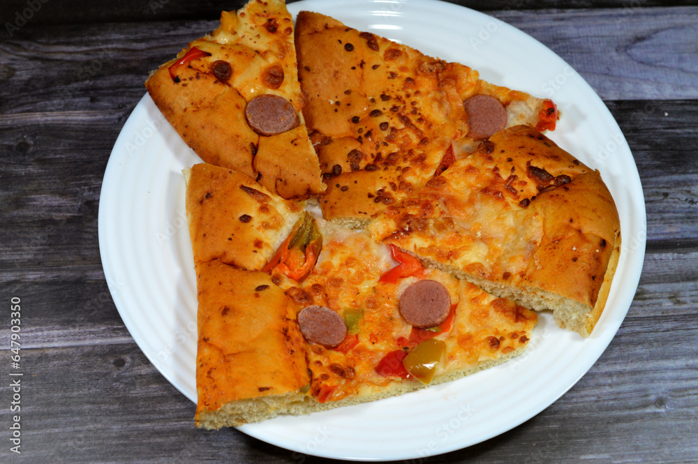 Foto Stock Cheese Fougasse topped with slices of green peppers, cheese ...