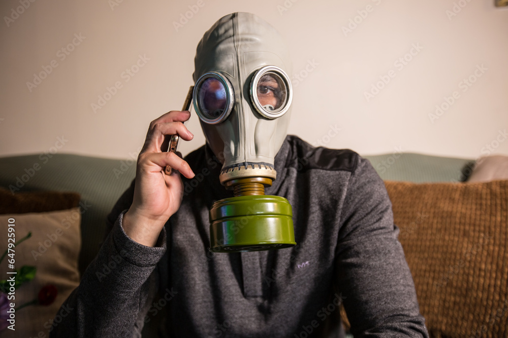 Civilian wearing nuclear gas mask during nuclear fallout and a time of ...