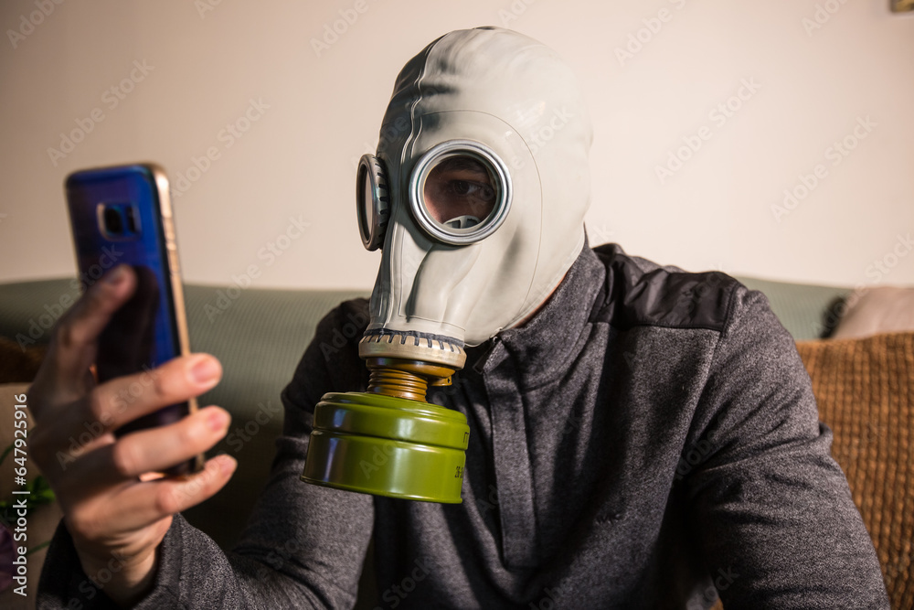 Civilian wearing nuclear gas mask during nuclear fallout and a time of ...