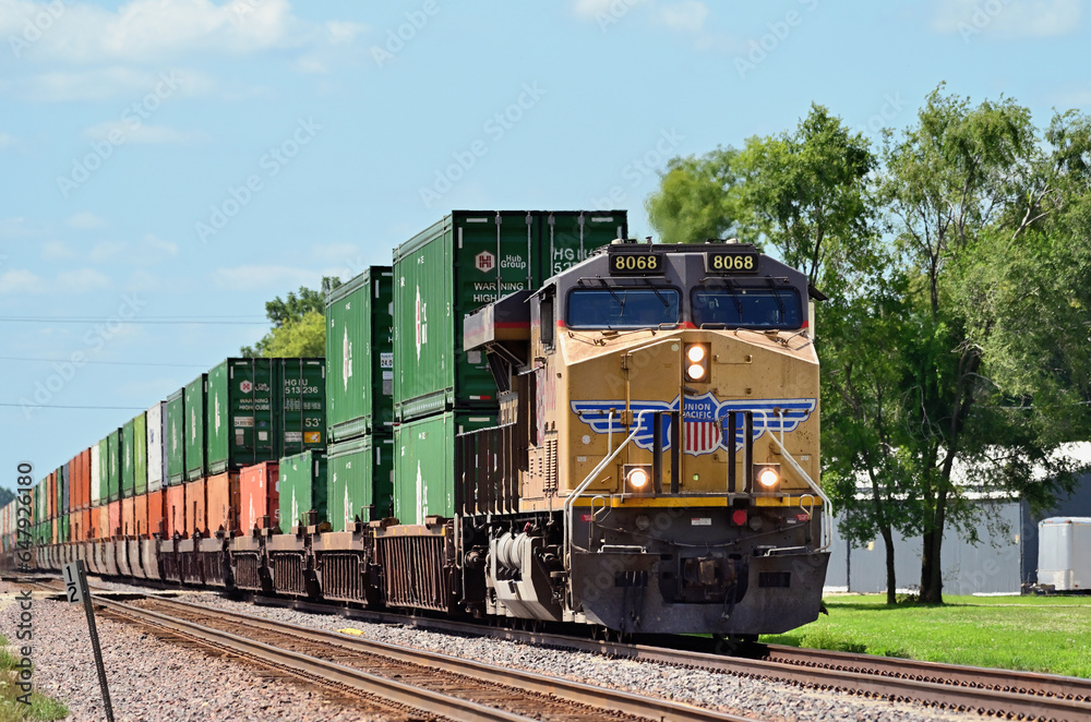 A single locomotive leads a Union Pacific intermodal freight train ...